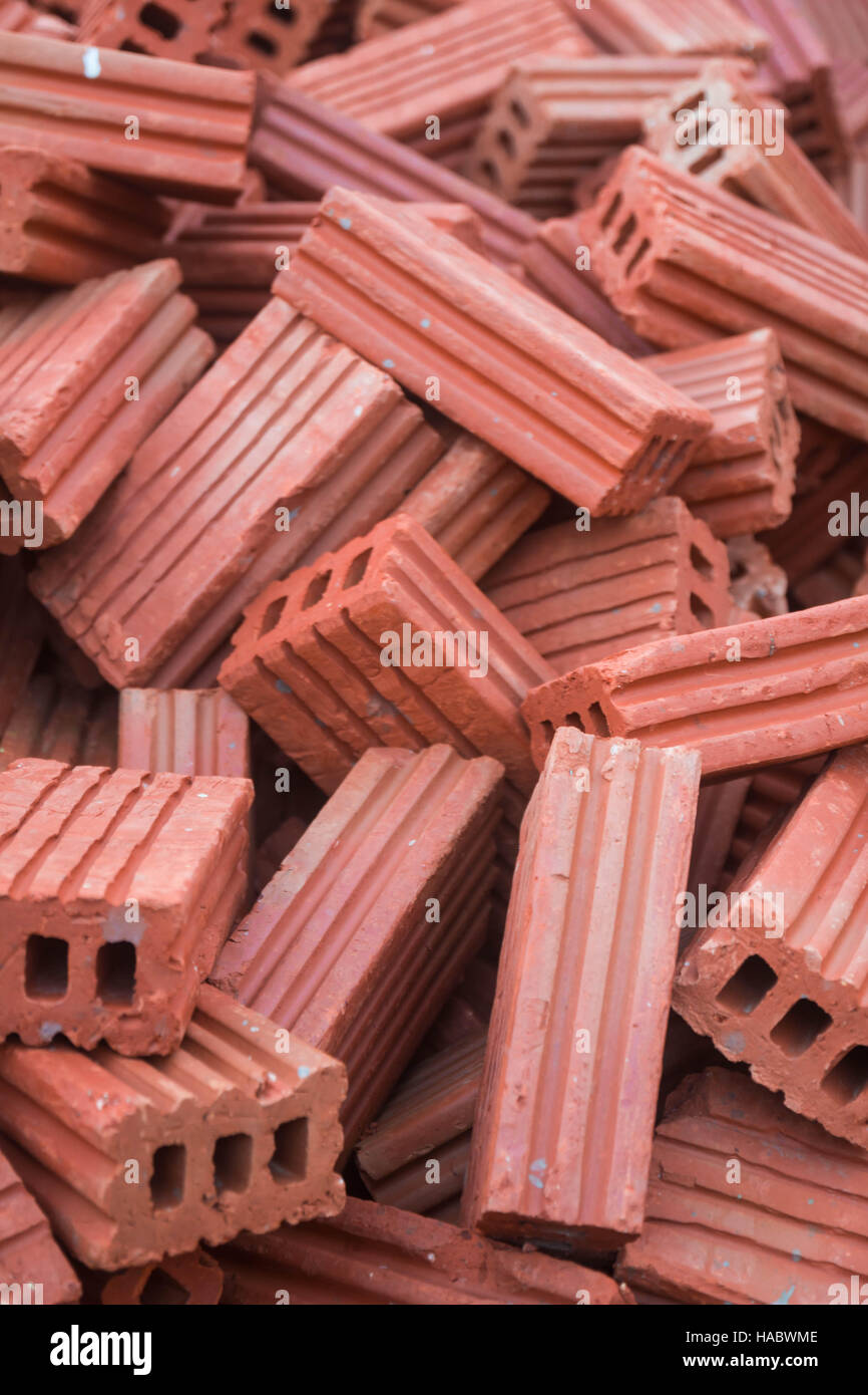 Orange heap bricks for construction Stock Photo - Alamy