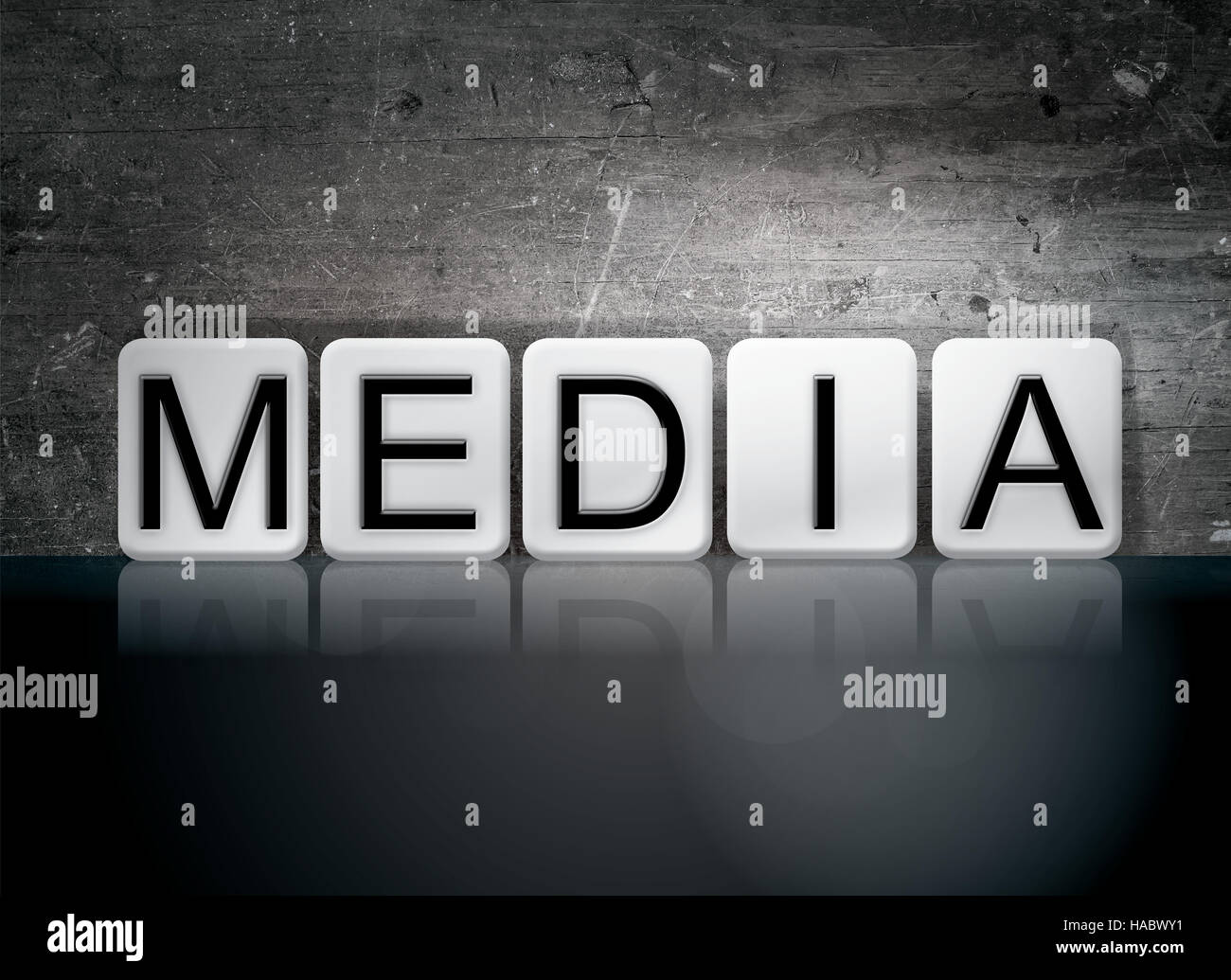 The word "Media" written in white tiles against a dark vintage grunge ...