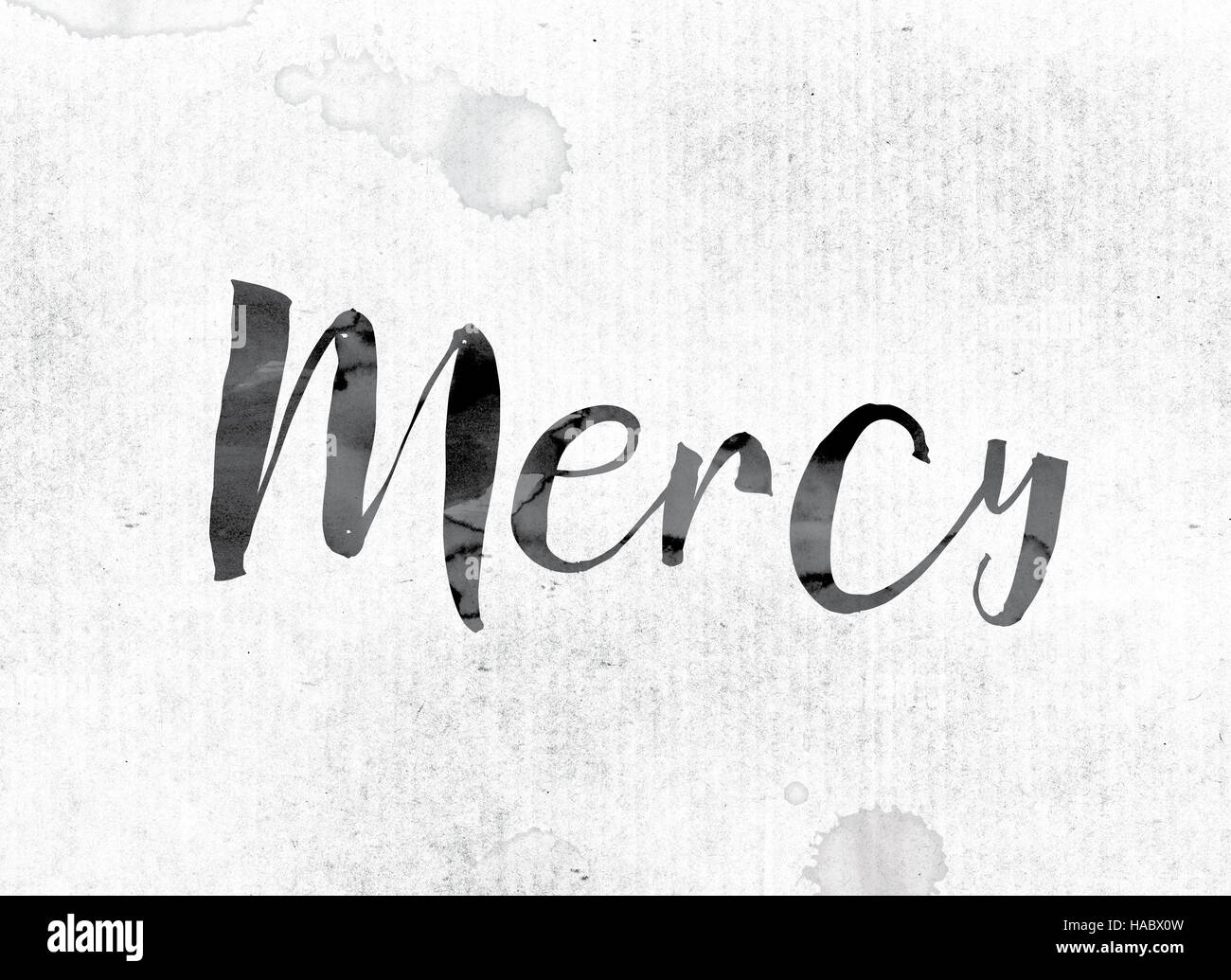 The word "Mercy" concept and theme painted in watercolor ink on a white ...