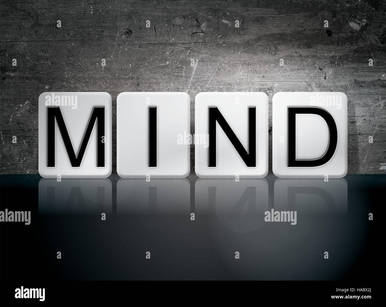 The word "Mind" written in white tiles against a dark vintage grunge ...