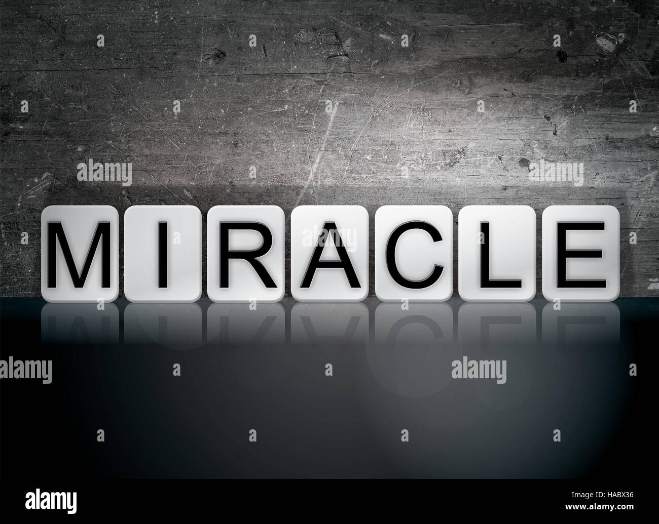 The word "Miracle" written in white tiles against a dark vintage grunge ...