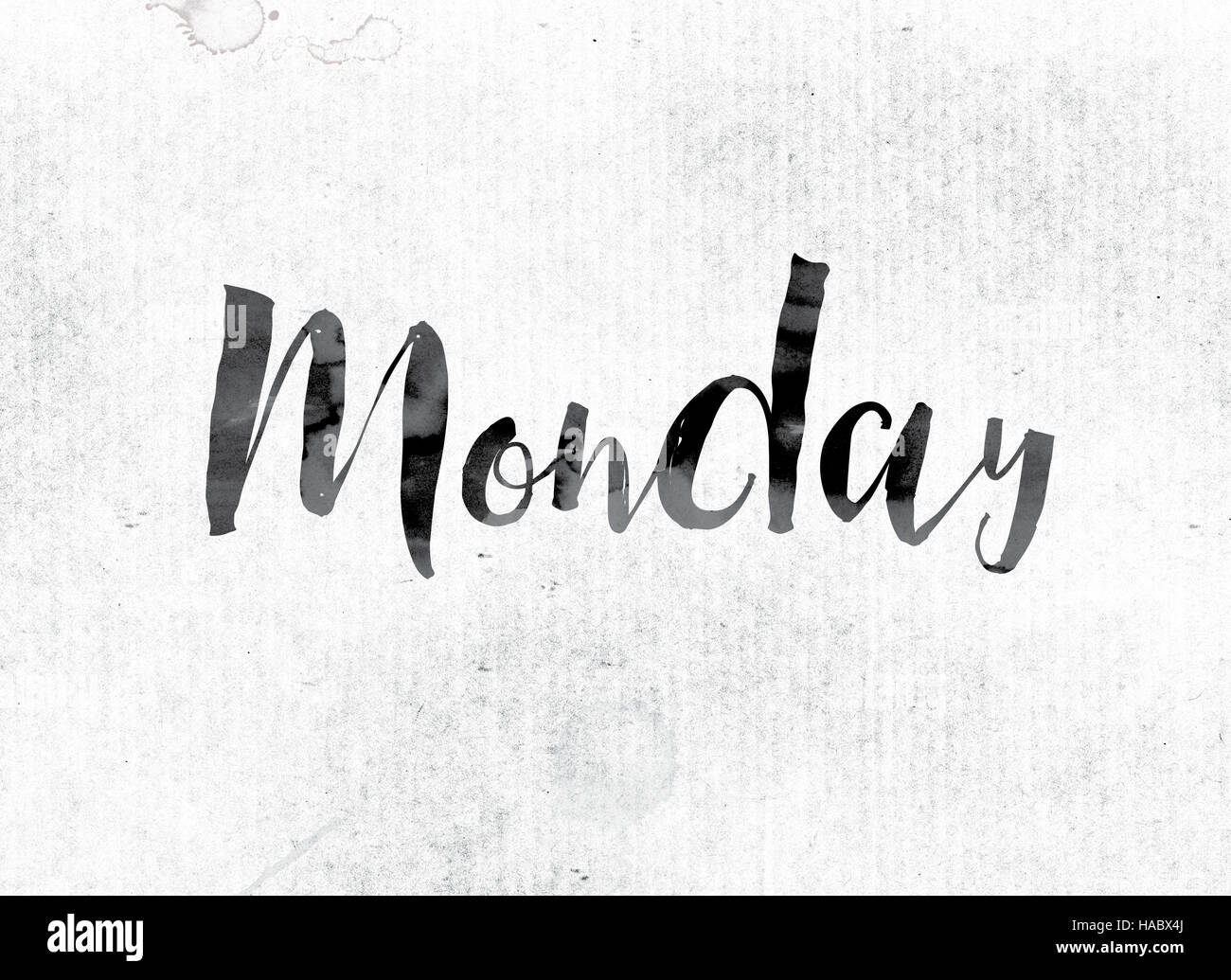 The word "Monday" concept and theme painted in watercolor ink on a ...