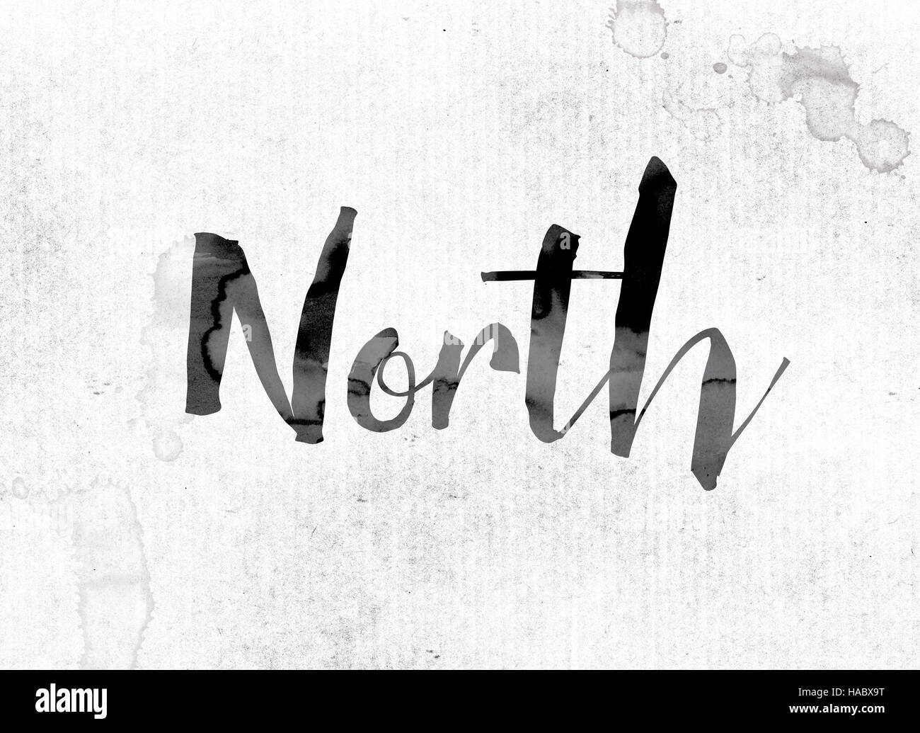 The word "North" concept and theme painted in watercolor ink on a white ...