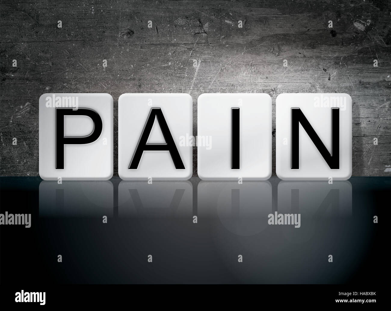 The word "Pain" written in white tiles against a dark vintage grunge ...