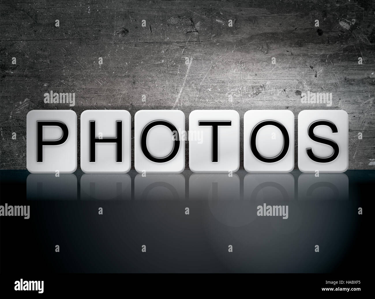 The word "Photos" written in white tiles against a dark vintage grunge ...