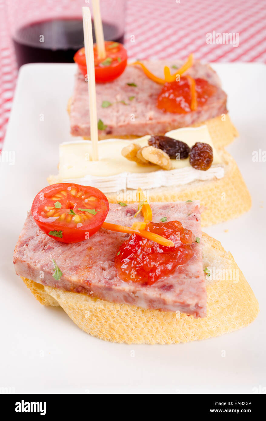 Serving of traditional Spanish pate tapa on a checkered tablecloth ...