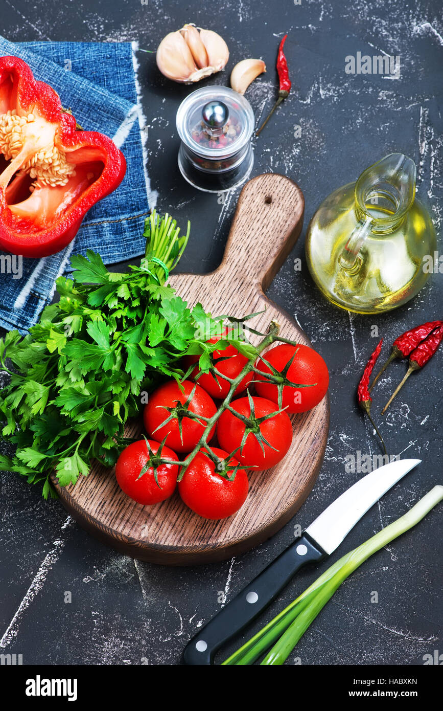 fresh tomato on board and on a table Stock Photo - Alamy