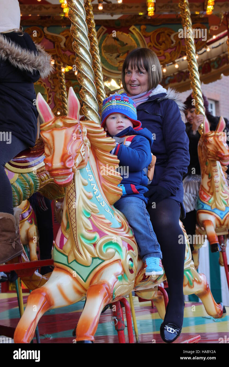 :People riding on an old retro carousel at the yearly Christmas ...