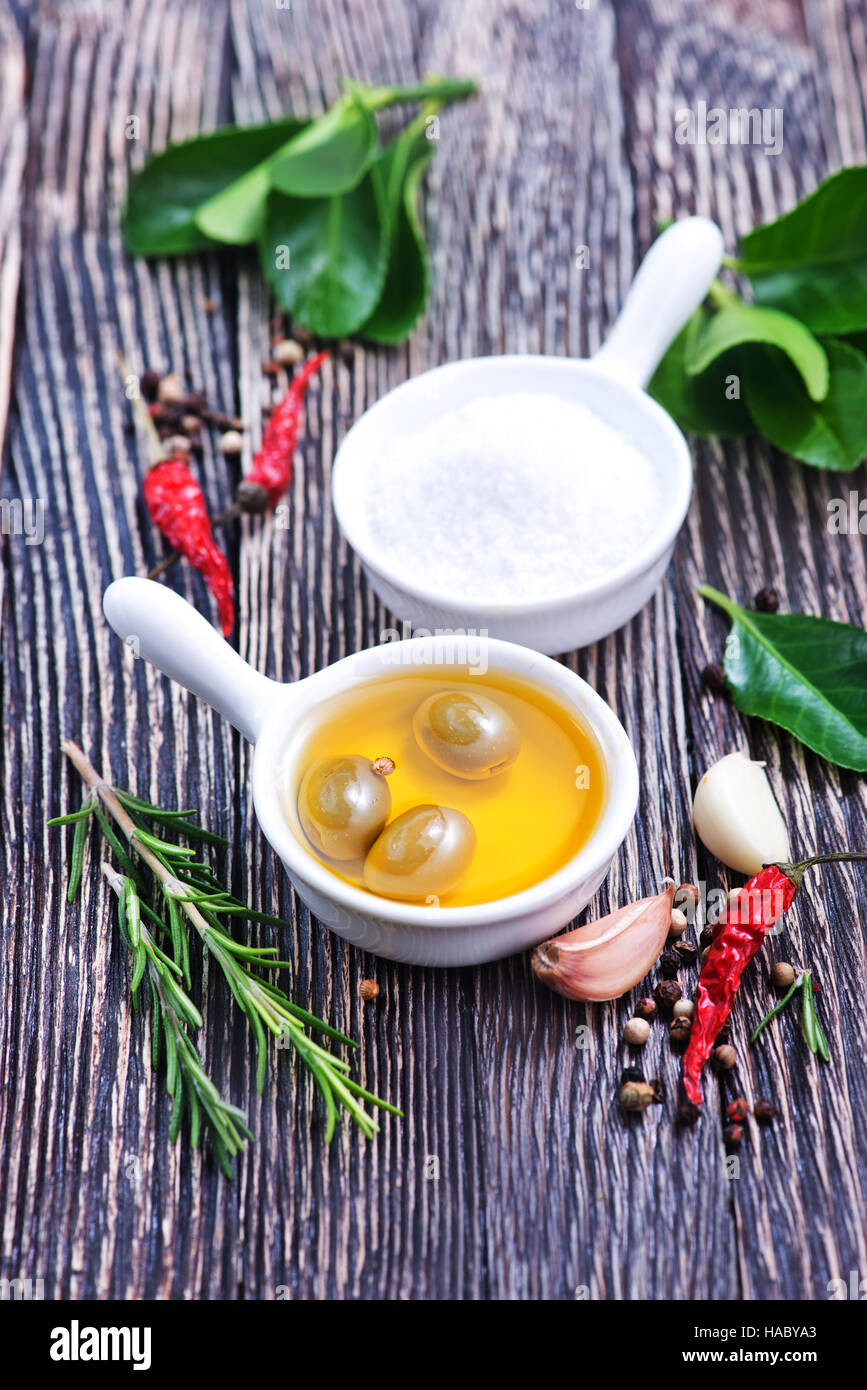 olive oil and aroma spice on a table Stock Photo - Alamy