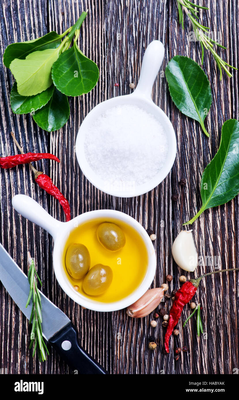 olive oil and aroma spice on a table Stock Photo - Alamy