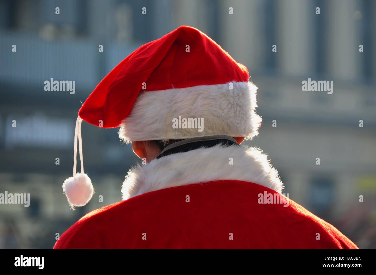 Santa Claus with cap back Stock Photo - Alamy