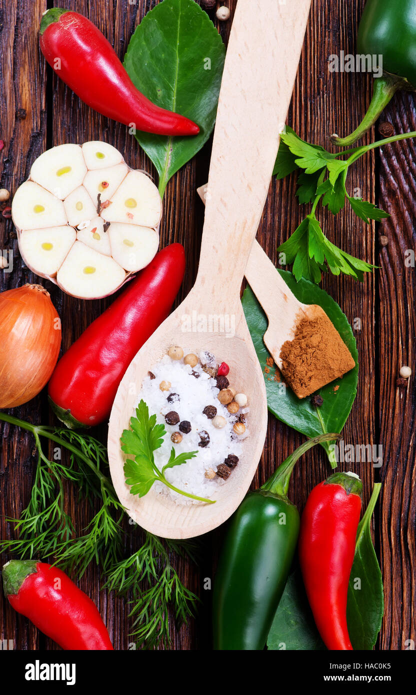 aroma spice in spoon and on the wooden table Stock Photo - Alamy
