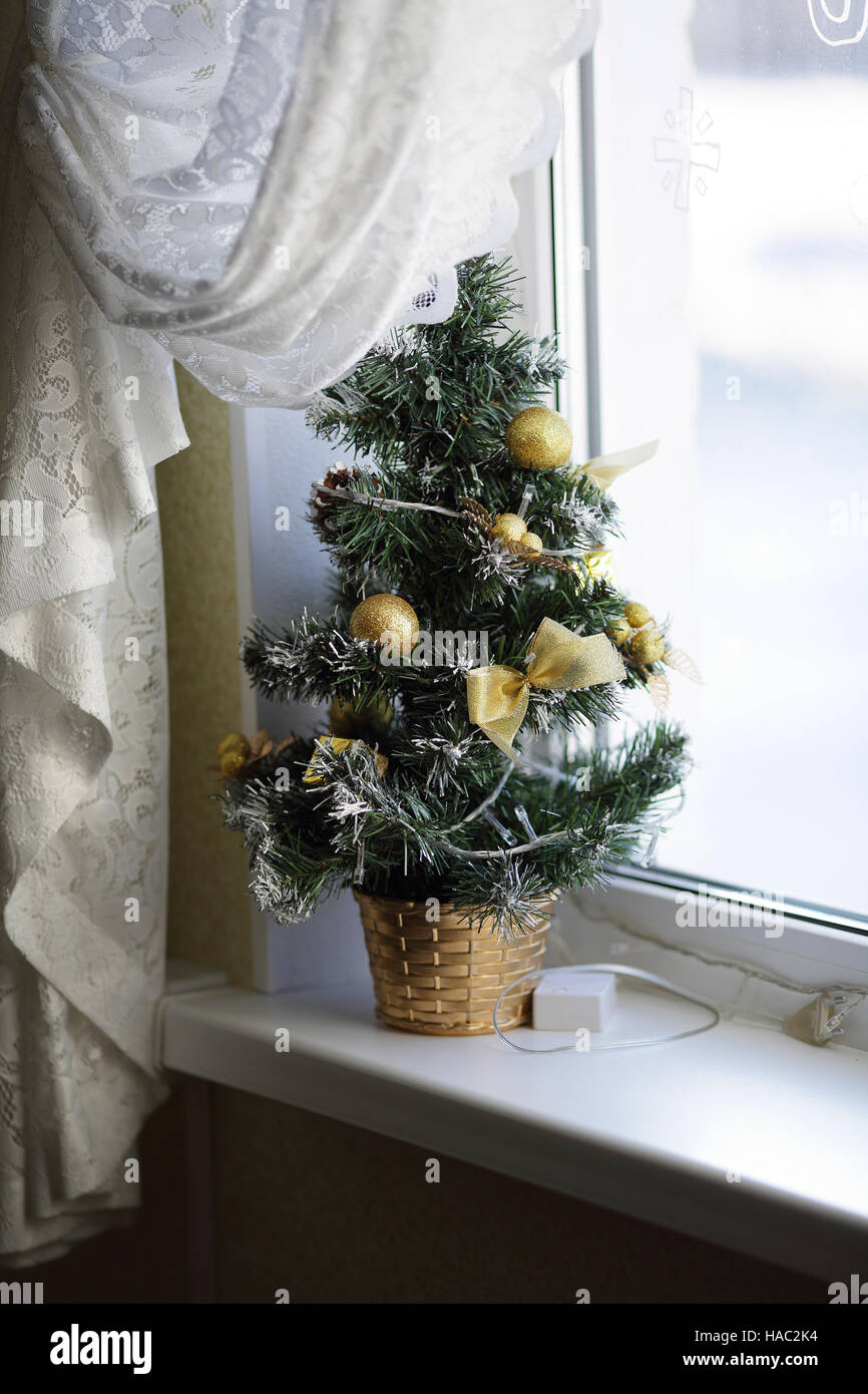Decorated christmas tree on window, holiday Stock Photo - Alamy