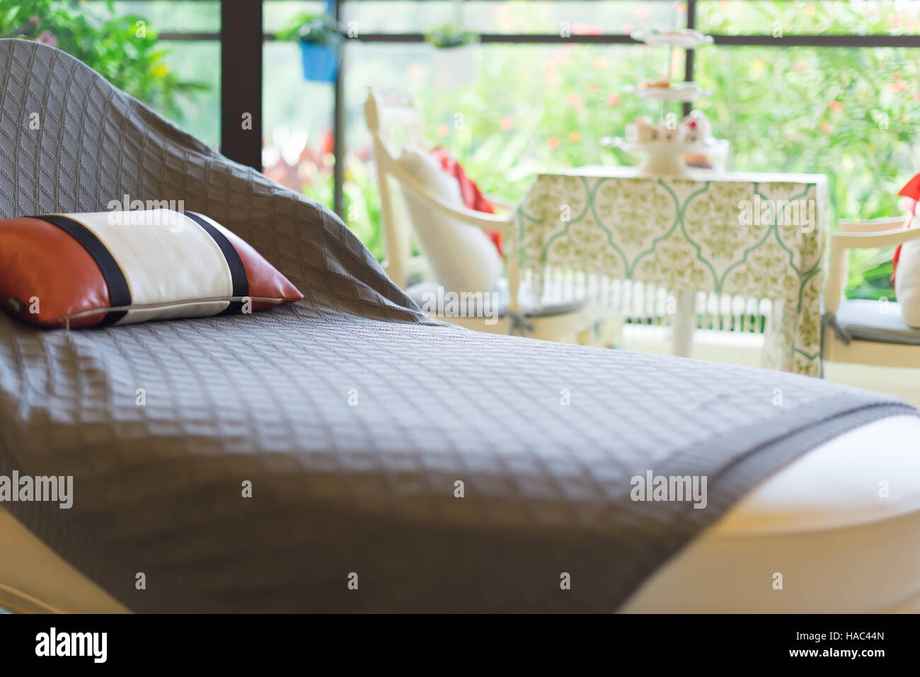 resting seat with pillow near to a cozy balcony in the morning Stock ...