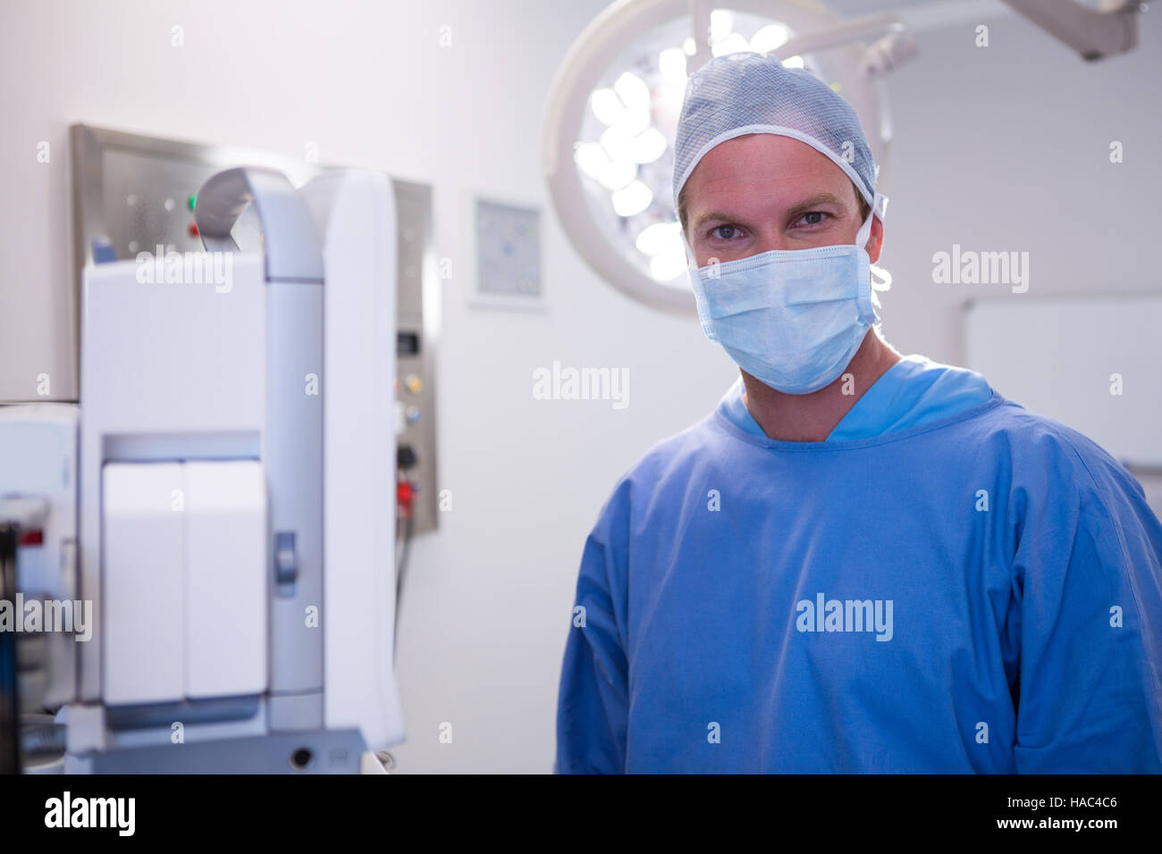 Portrait of surgeon standing in operation room Stock Photo - Alamy