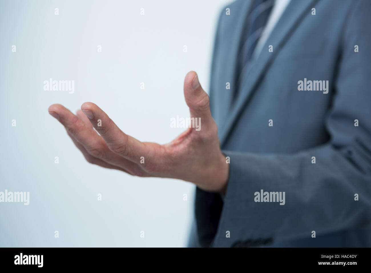 Mid section of a businessman offering a helping hand Stock Photo - Alamy