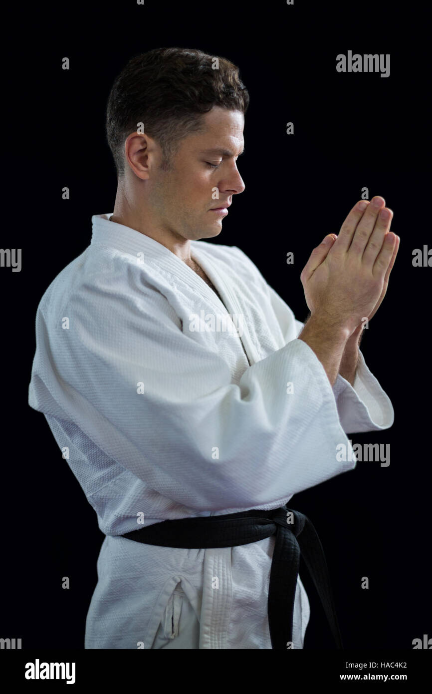 Karate player in prayer pose Stock Photo - Alamy