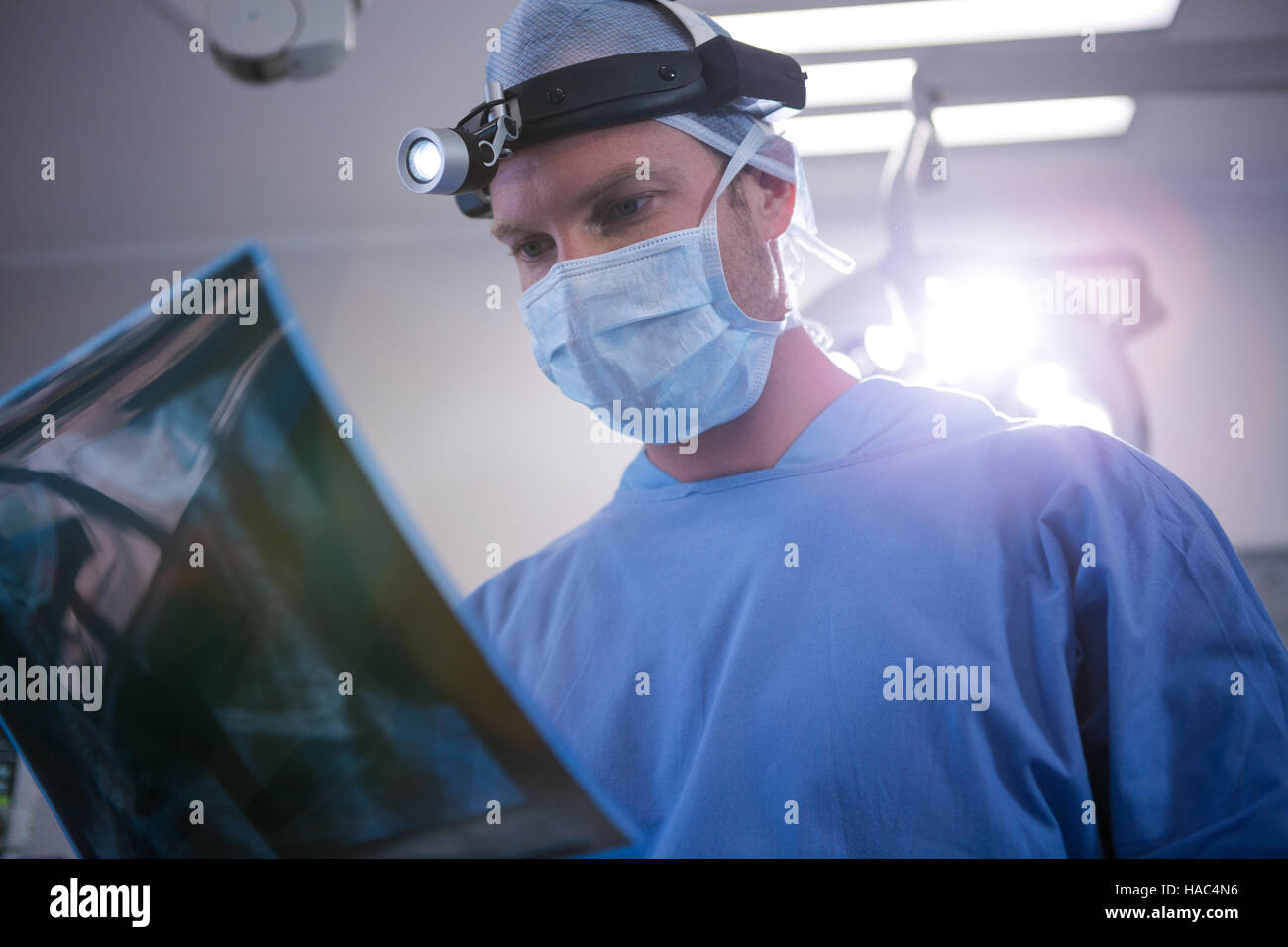 Male surgeon examining x-ray Stock Photo - Alamy