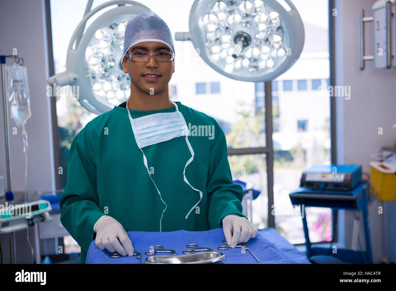 Portrait of surgeon standing in operation room Stock Photo - Alamy