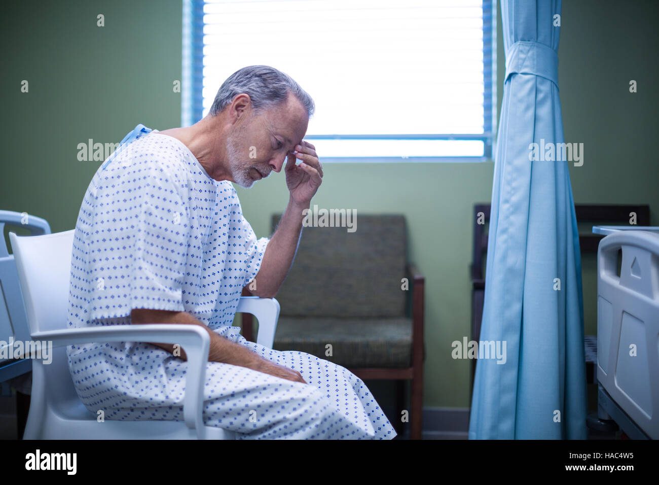 Sad Man Sitting In Chair