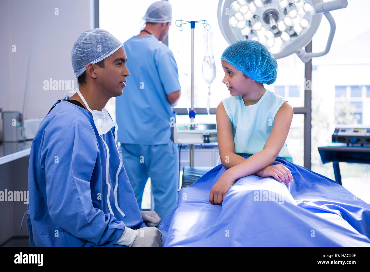 Doctor interacting with patient in operation room Stock Photo - Alamy