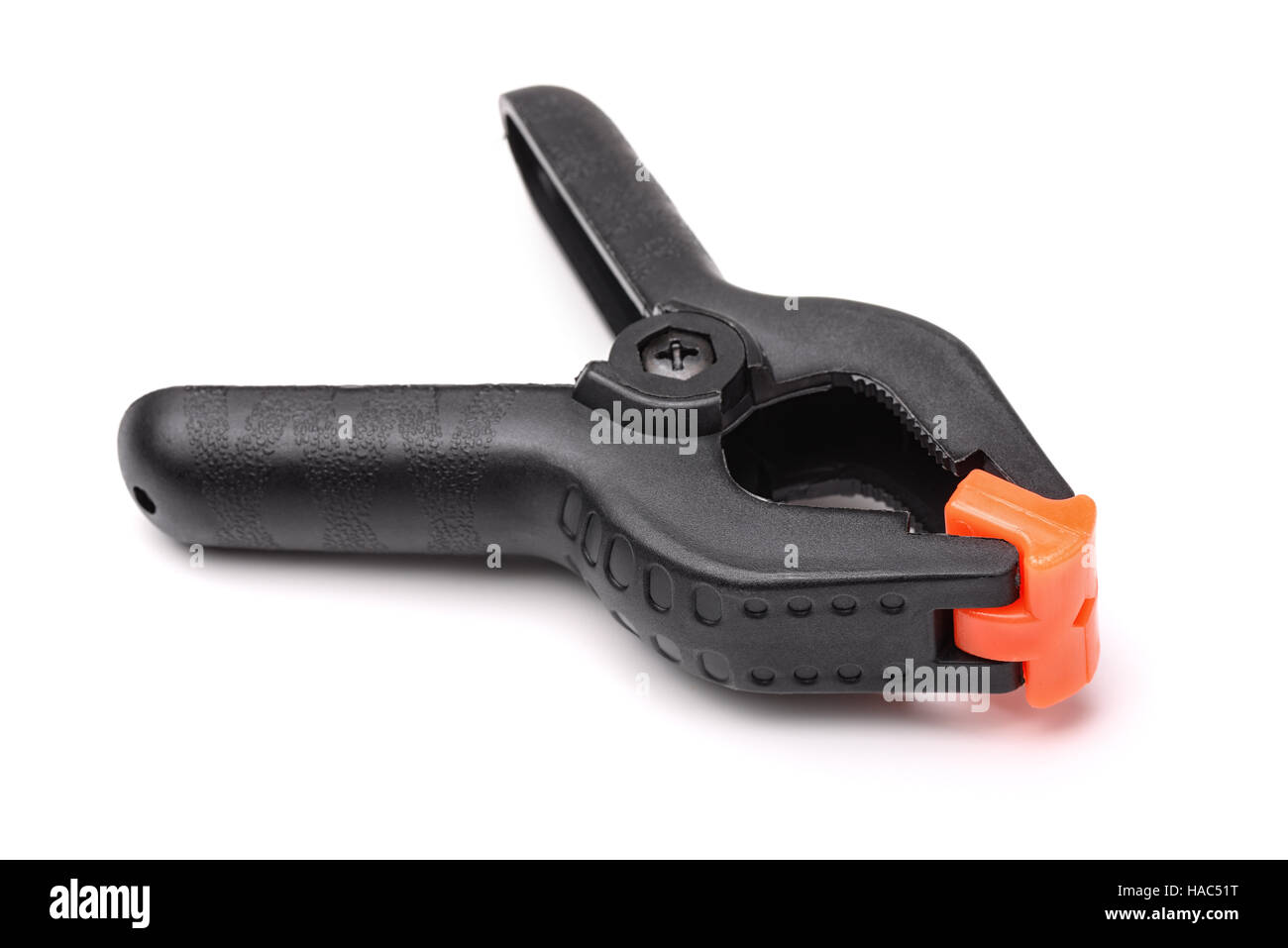 Black plastic spring clamp isolated on white Stock Photo - Alamy