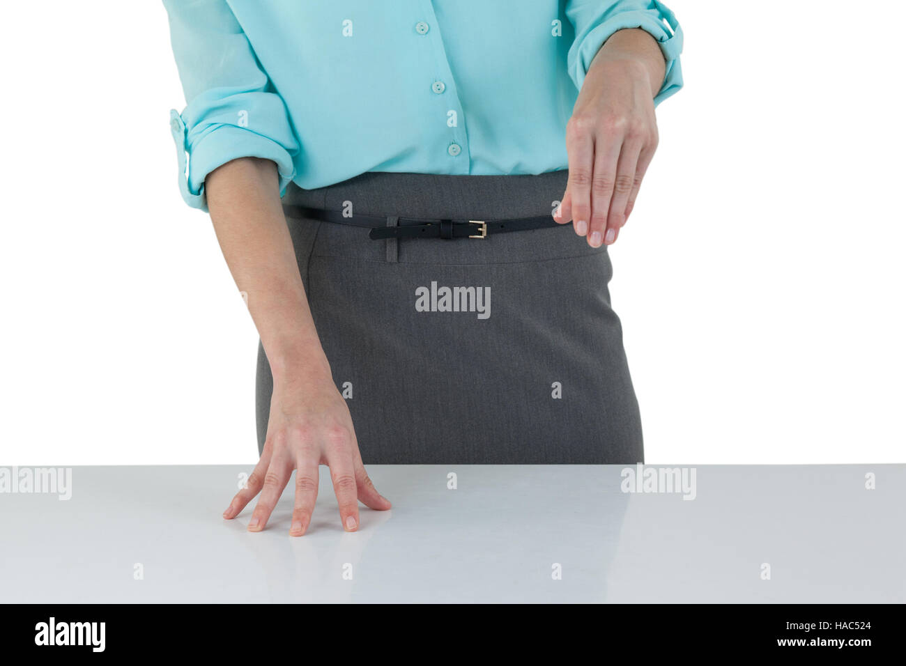 Mid section of business woman standing at table Stock Photo - Alamy