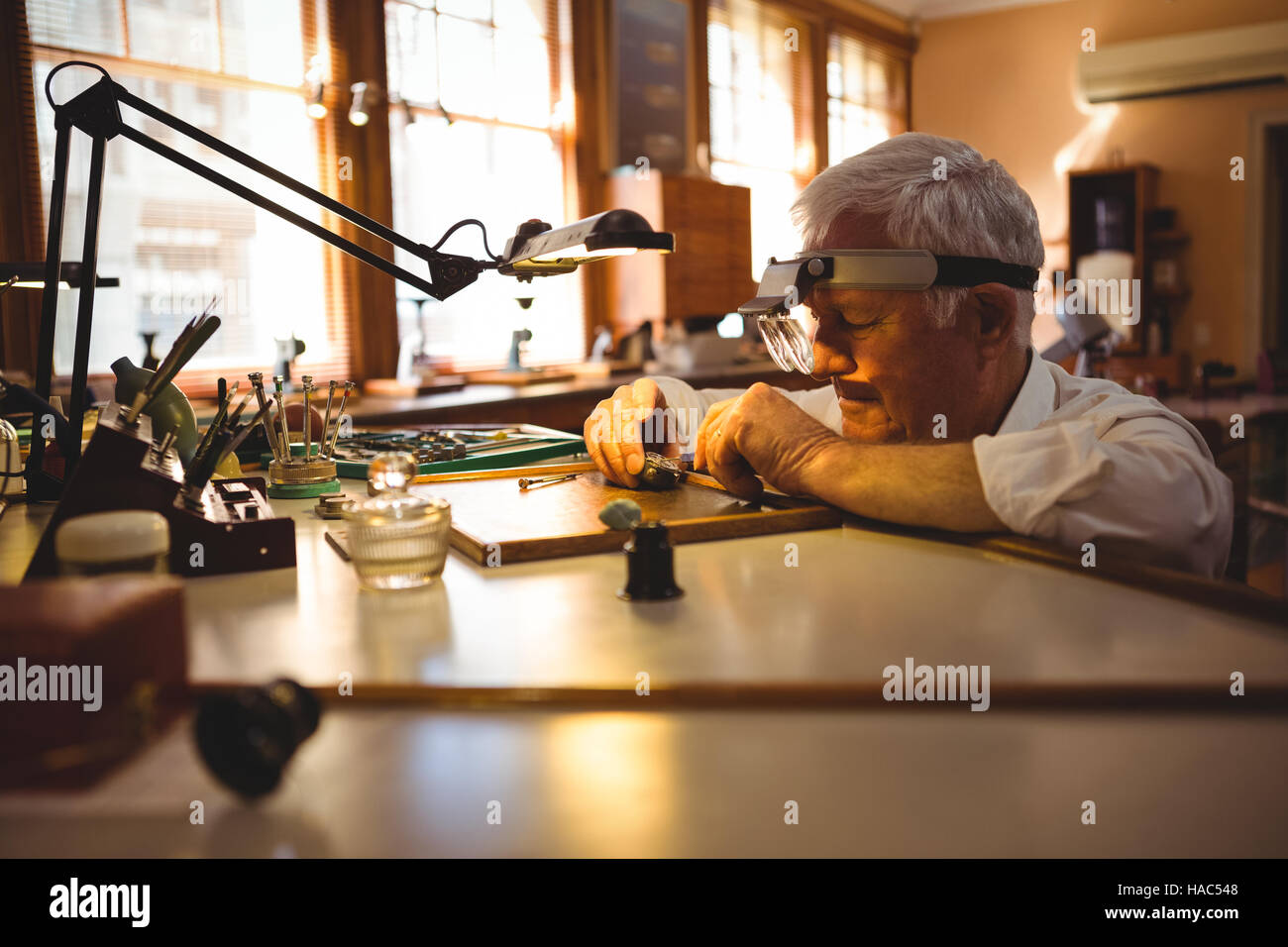 Horologist repairing a watch Stock Photo - Alamy