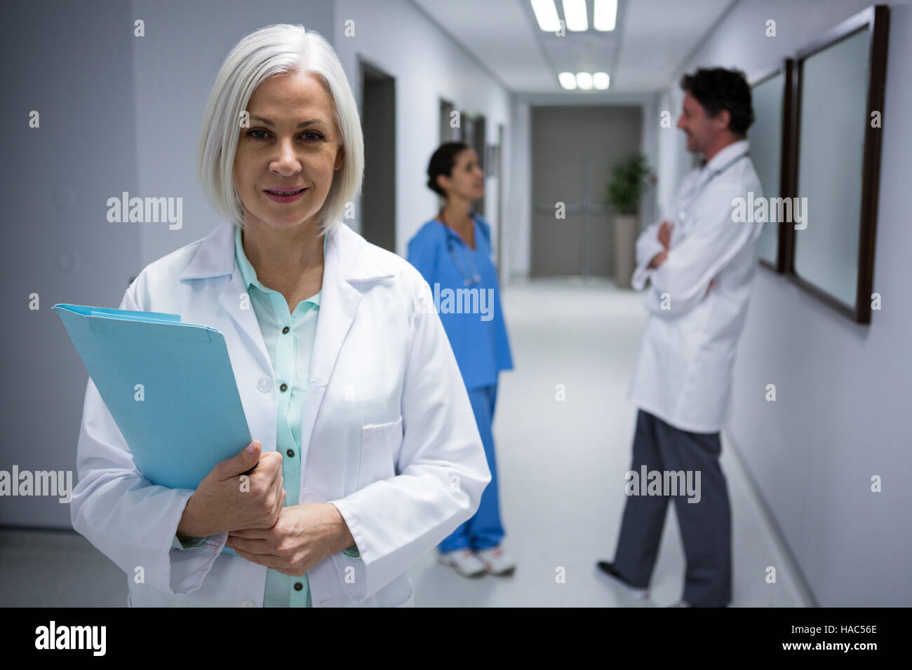 Portrait doctor holding file hi-res stock photography and images - Alamy