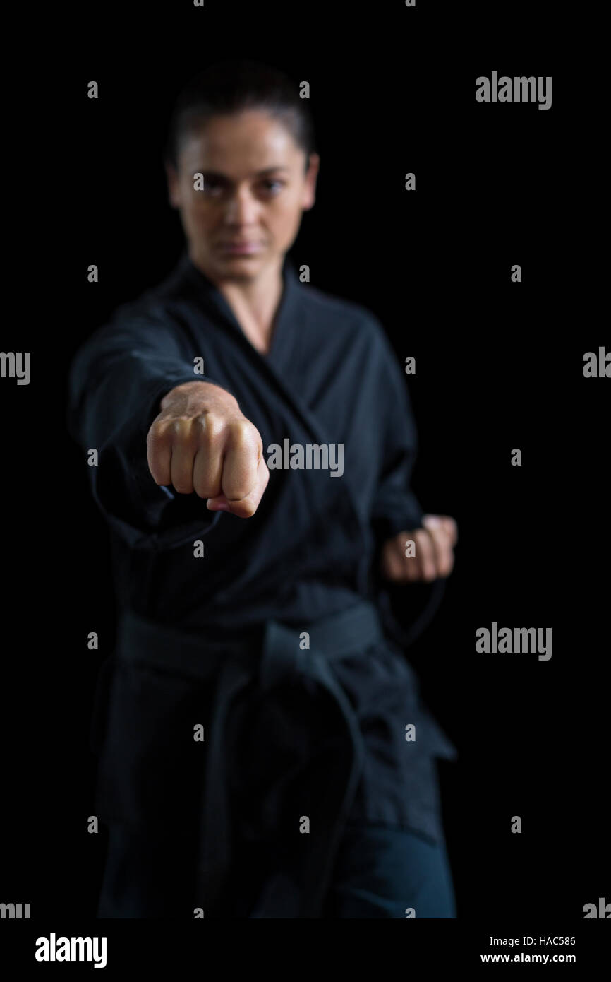 Female karate player performing karate stance Stock Photo - Alamy