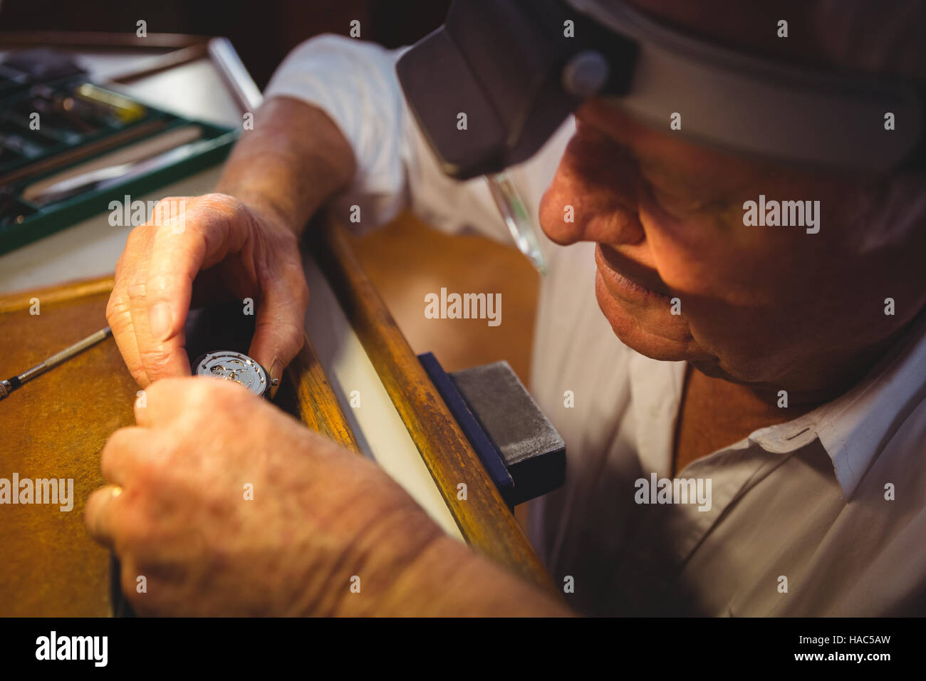 Horologist repairing a watch Stock Photo - Alamy
