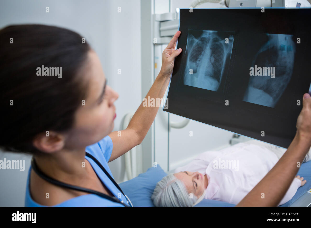 Doctor performing ray patient hi-res stock photography and images - Alamy