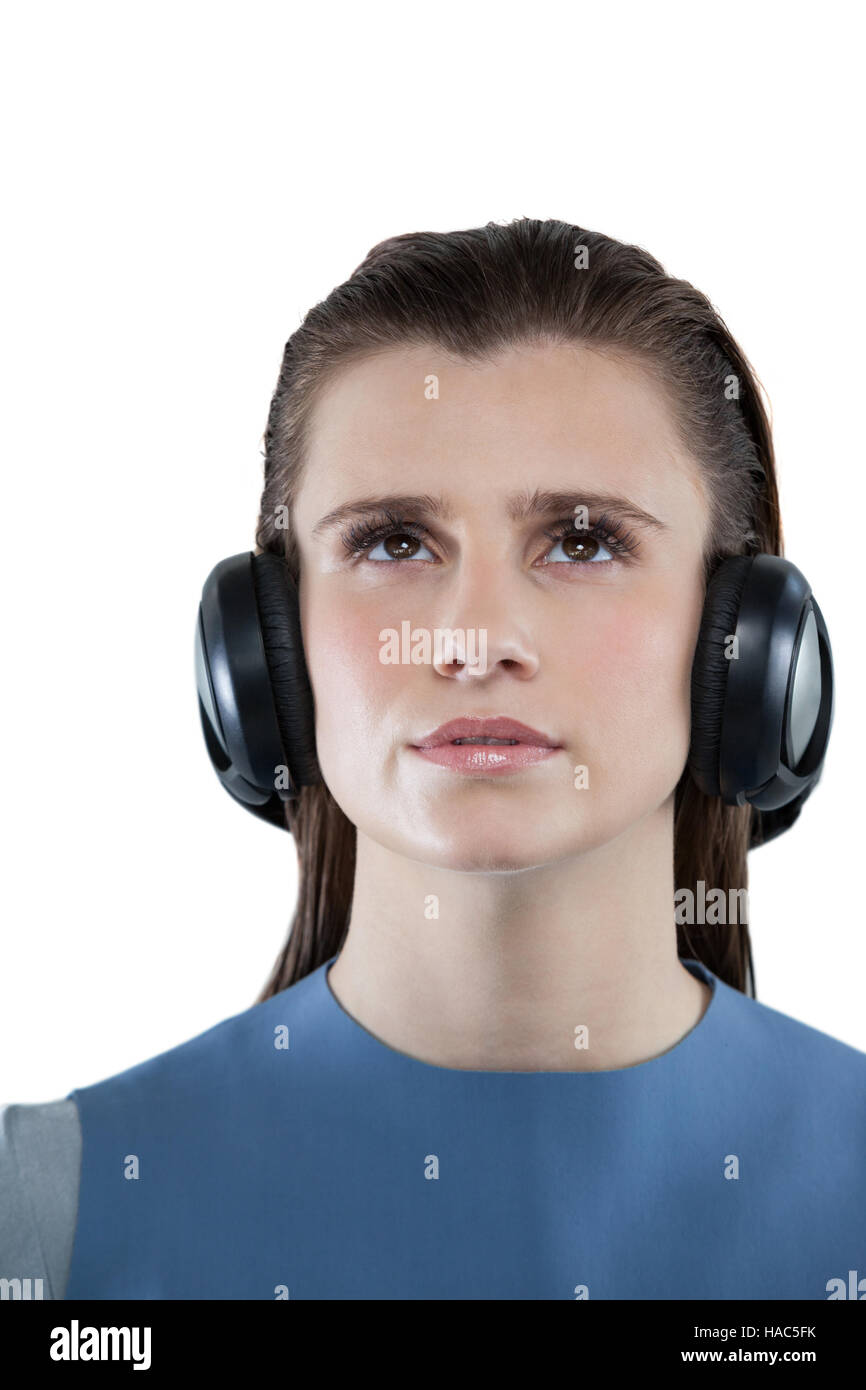 Beautiful woman listening to music on headphones Stock Photo - Alamy