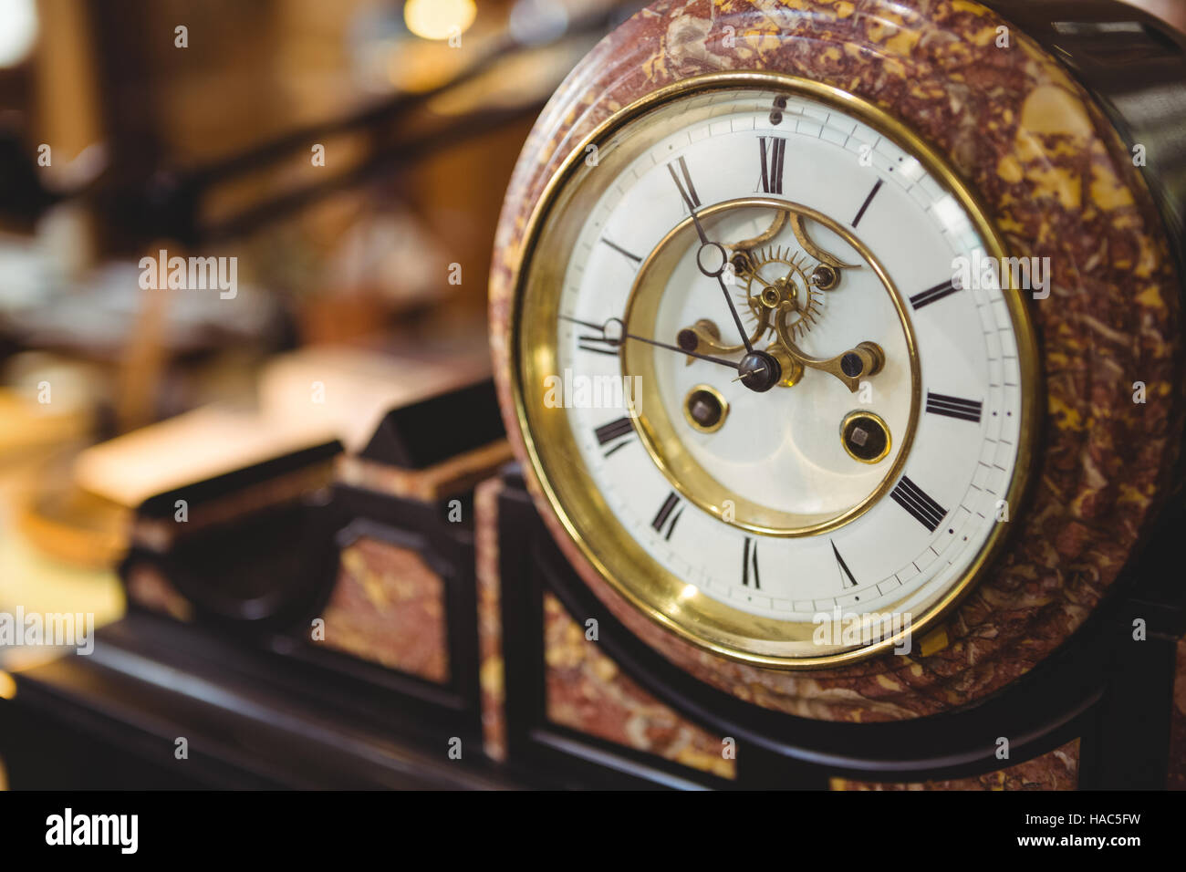 Close-up of round watch on table Stock Photo - Alamy