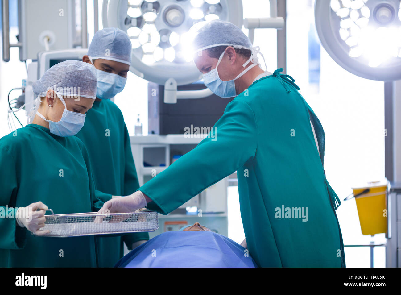 Surgeons performing operation in operation theater Stock Photo - Alamy