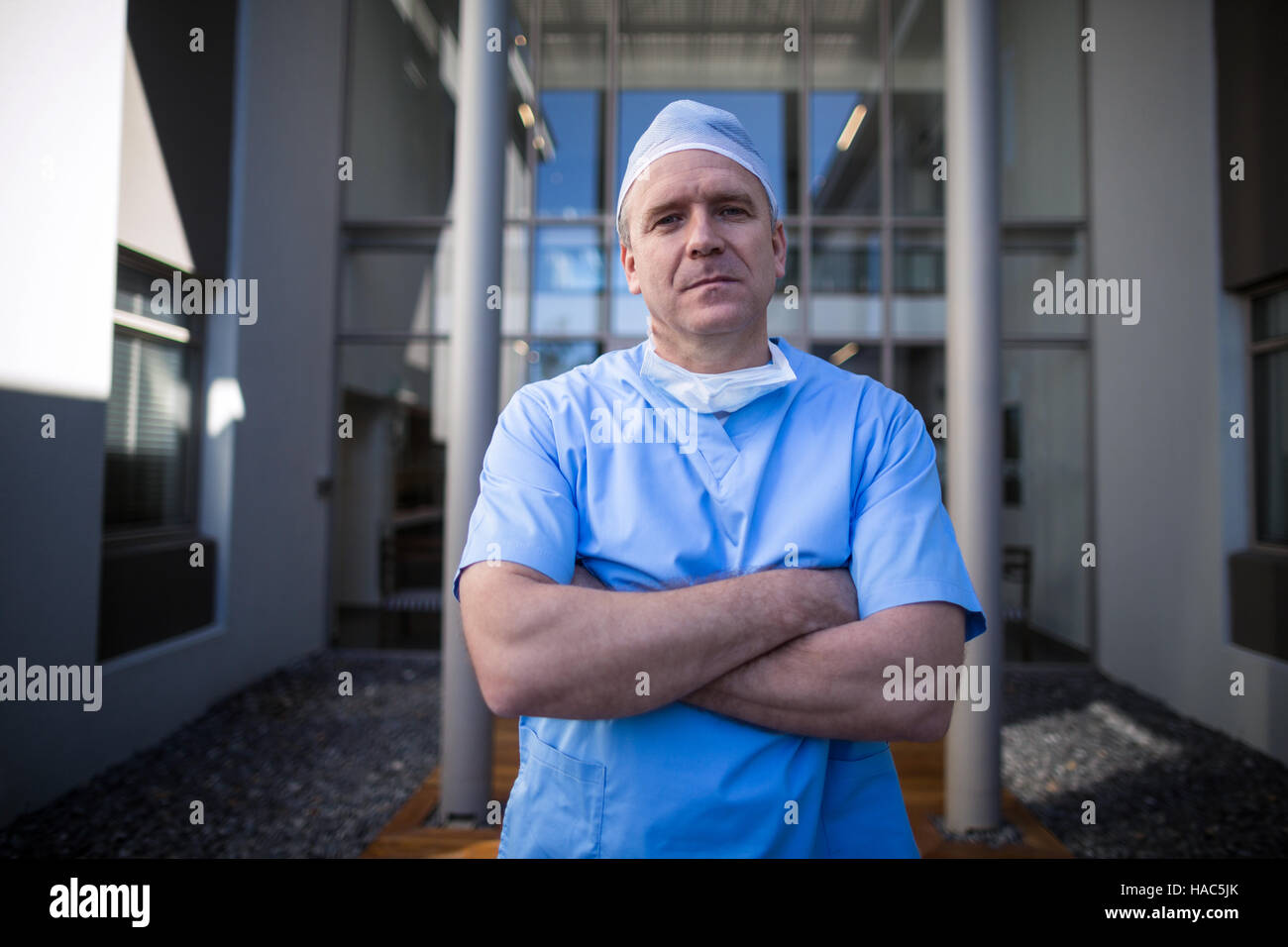 Portrait of male surgeon standing with arms crossed Stock Photo - Alamy