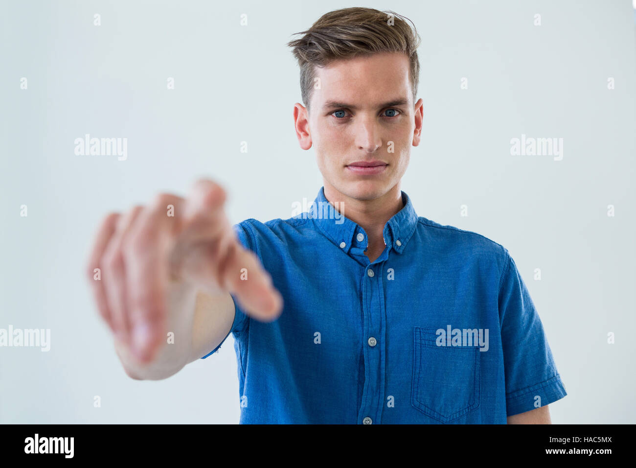 Man touching an invisible screen Stock Photo - Alamy
