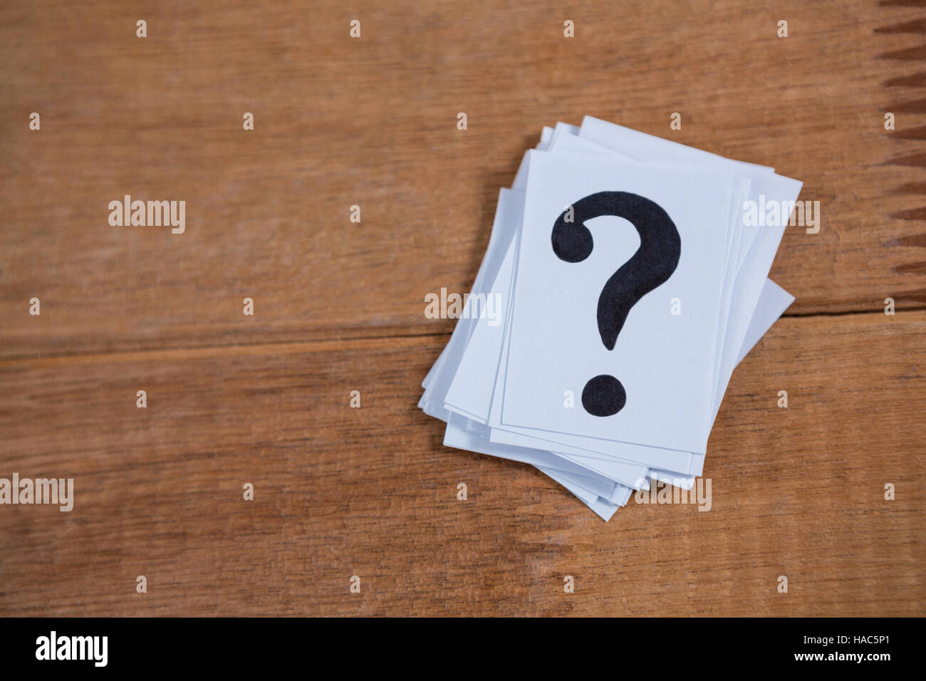 Stack of cards with a question mark Stock Photo - Alamy