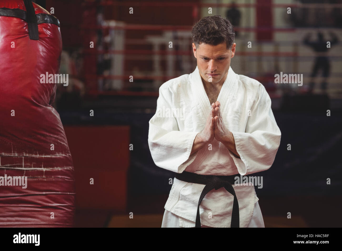 Karate player in prayer pose Stock Photo - Alamy