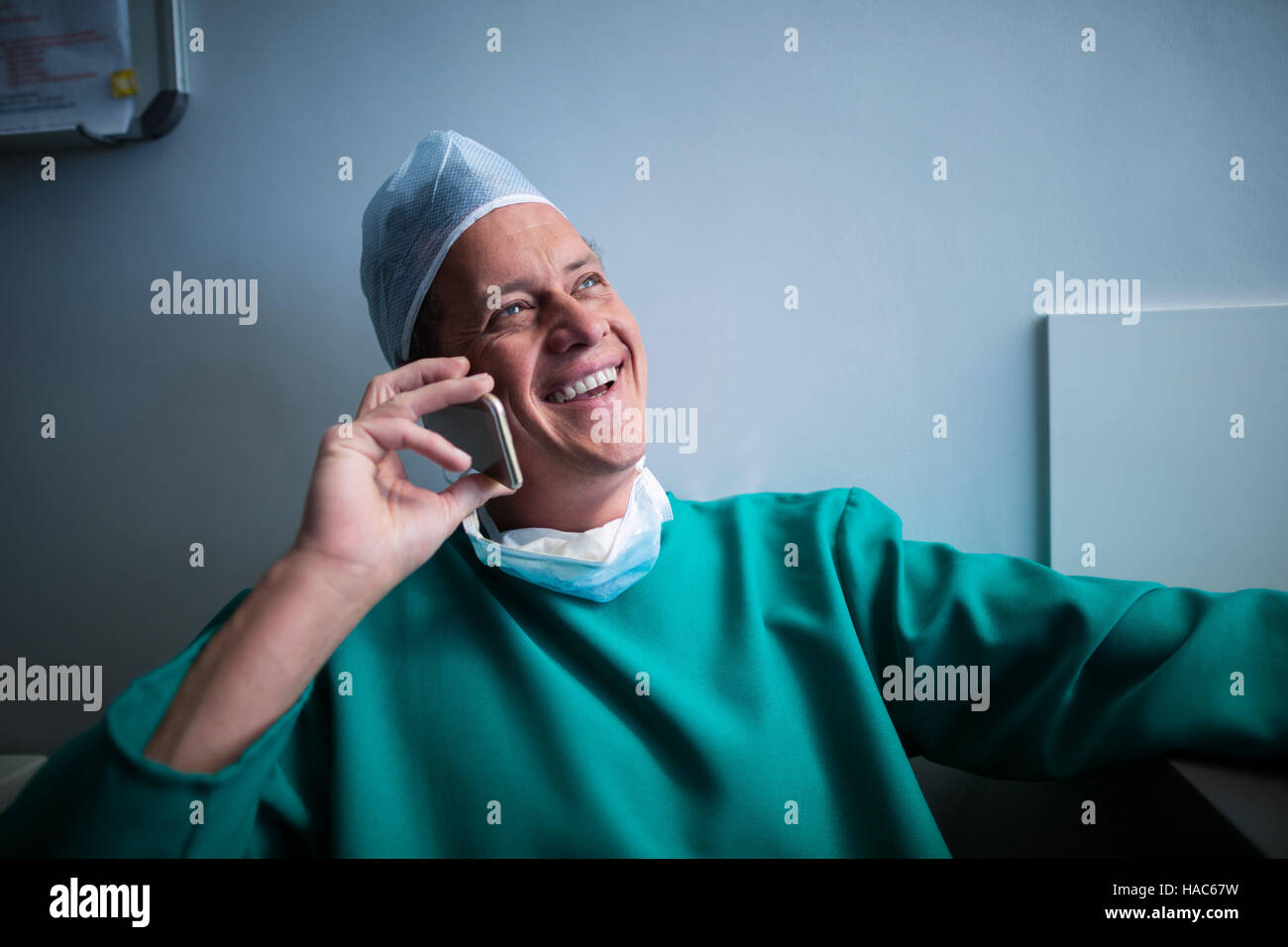 Cheerful physician talking on mobile hi-res stock photography and ...