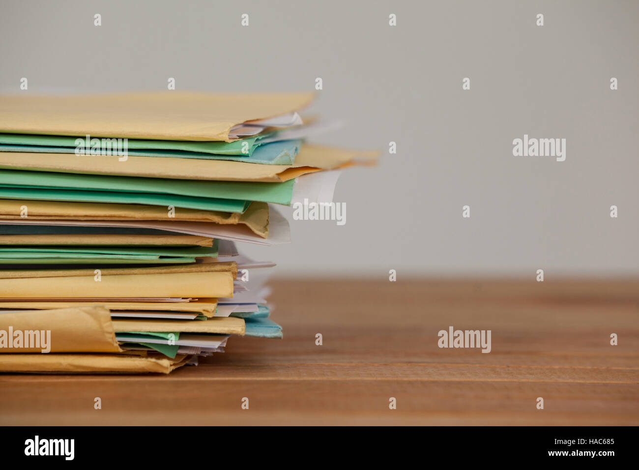 Files on wooden desk Stock Photo - Alamy