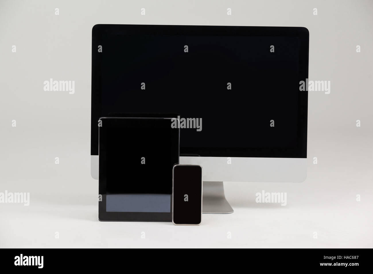 Computer, tablet and mobile phone on white background Stock Photo - Alamy