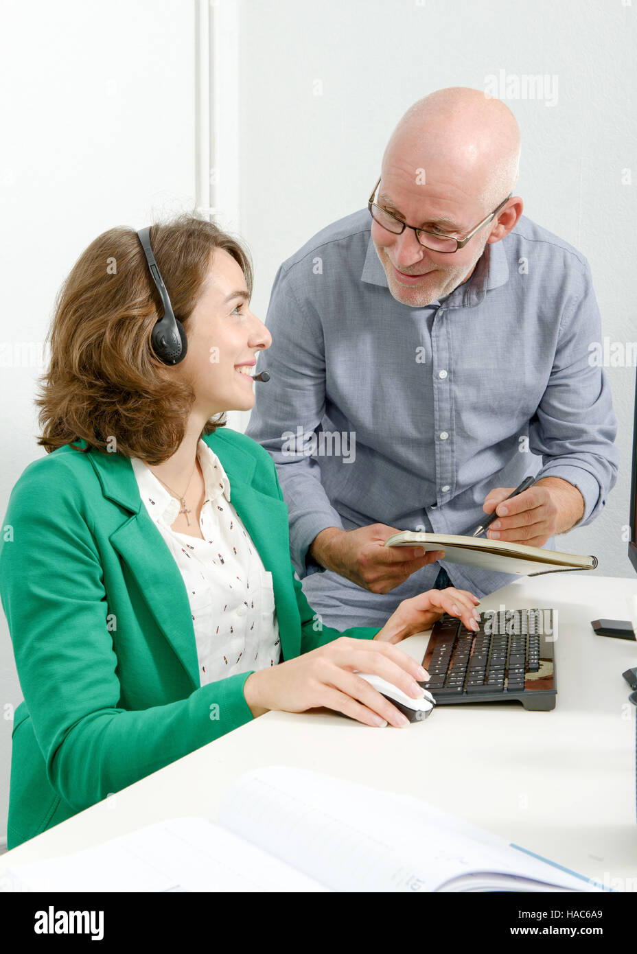 beautiful young secretary and his boss in the office Stock Photo - Alamy