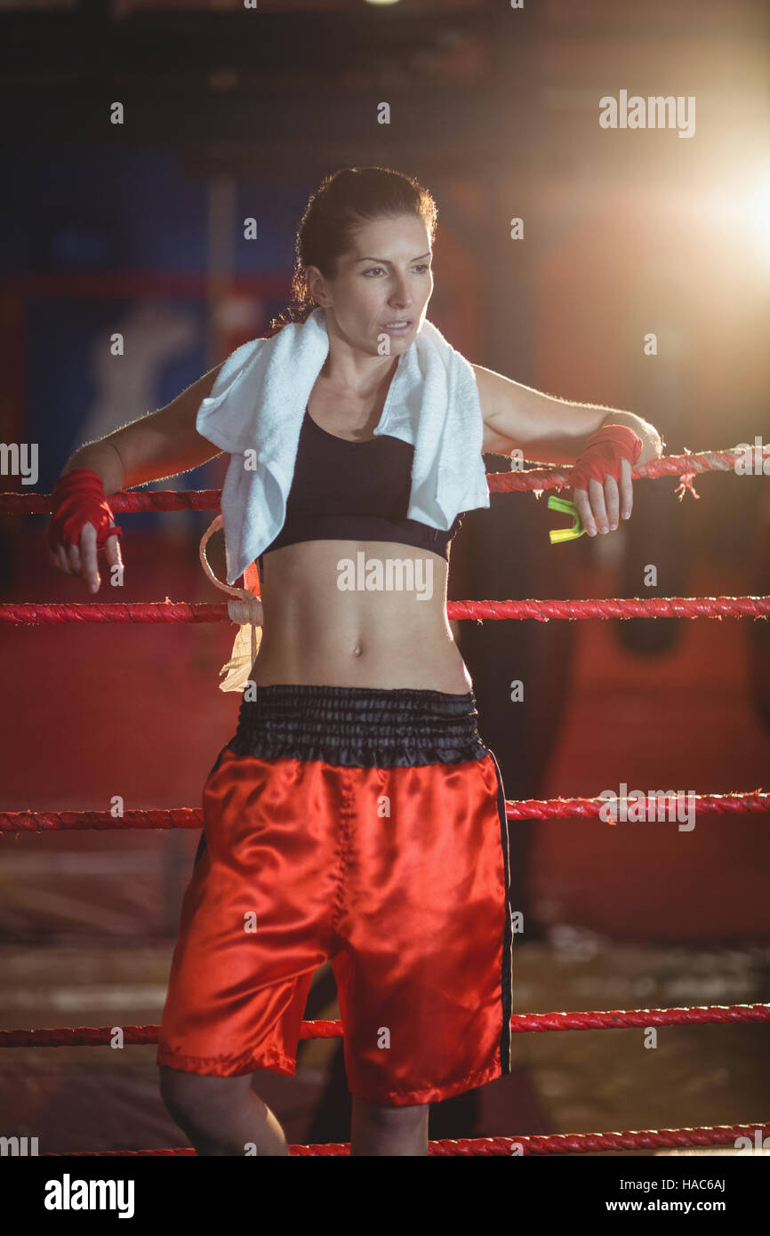 Female boxer standing in boxing ring Stock Photo - Alamy