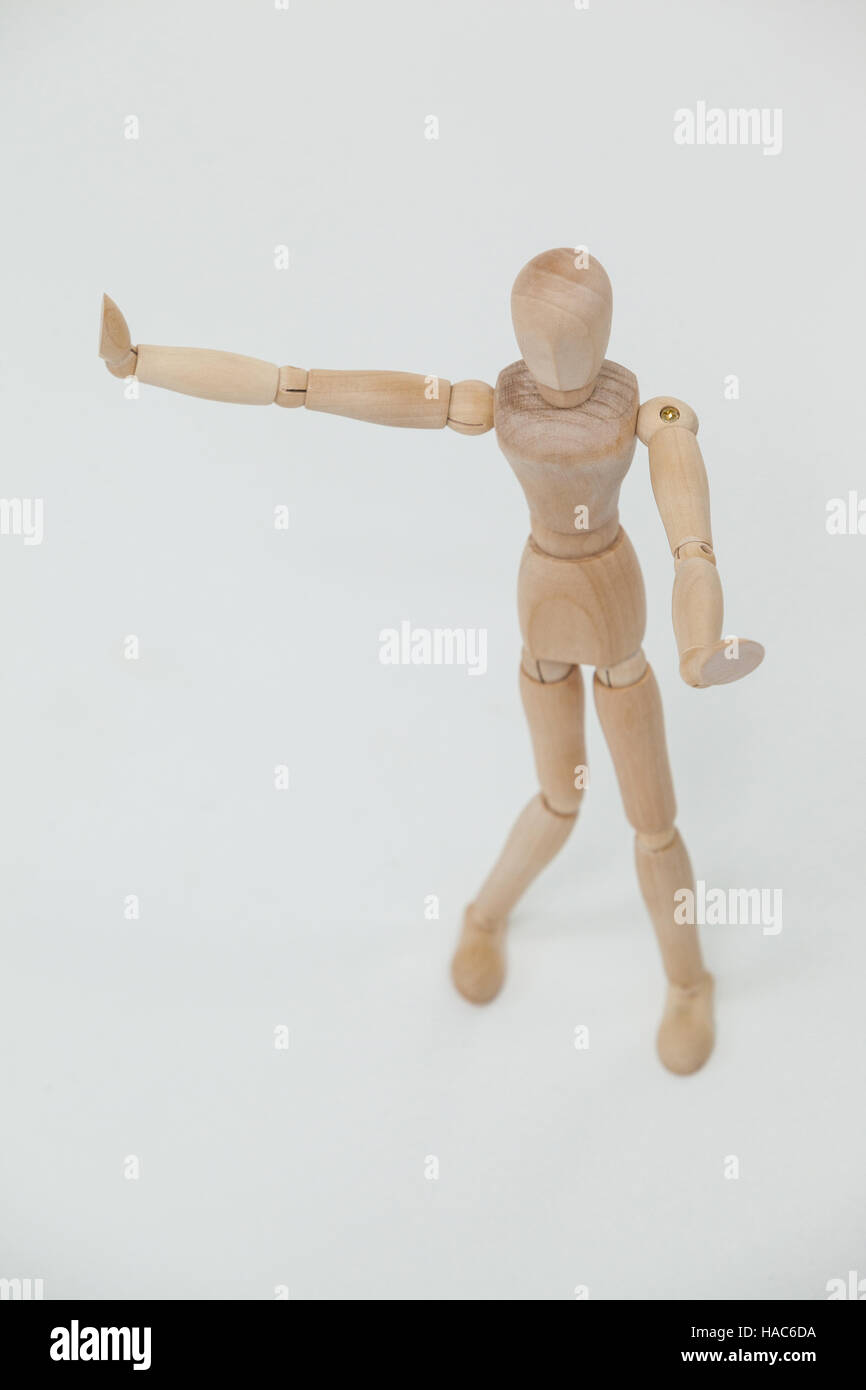 Wooden figurine standing and showing hand stop sign Stock Photo - Alamy
