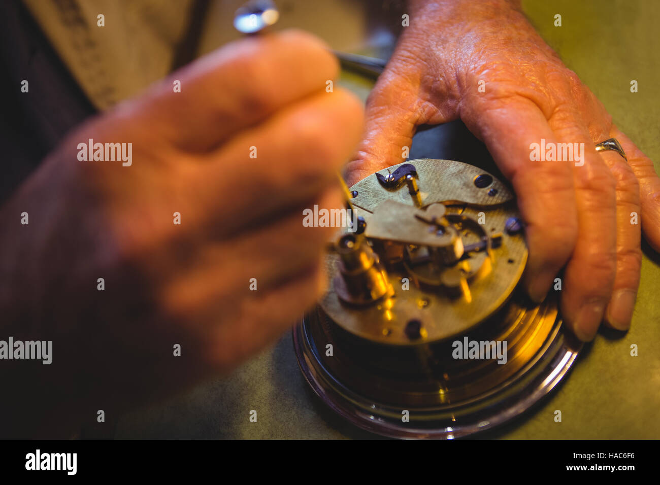 Horologist repairing a watch Stock Photo - Alamy