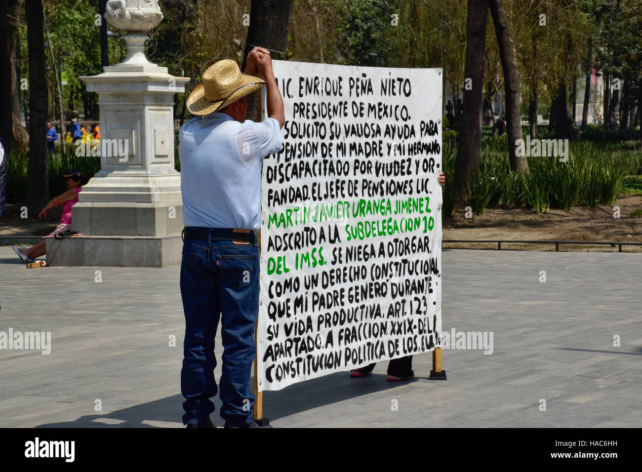 Mexican man with protest sign Stock Photo - Alamy