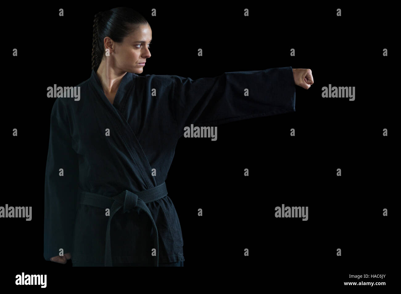 Female karate player performing karate stance Stock Photo - Alamy
