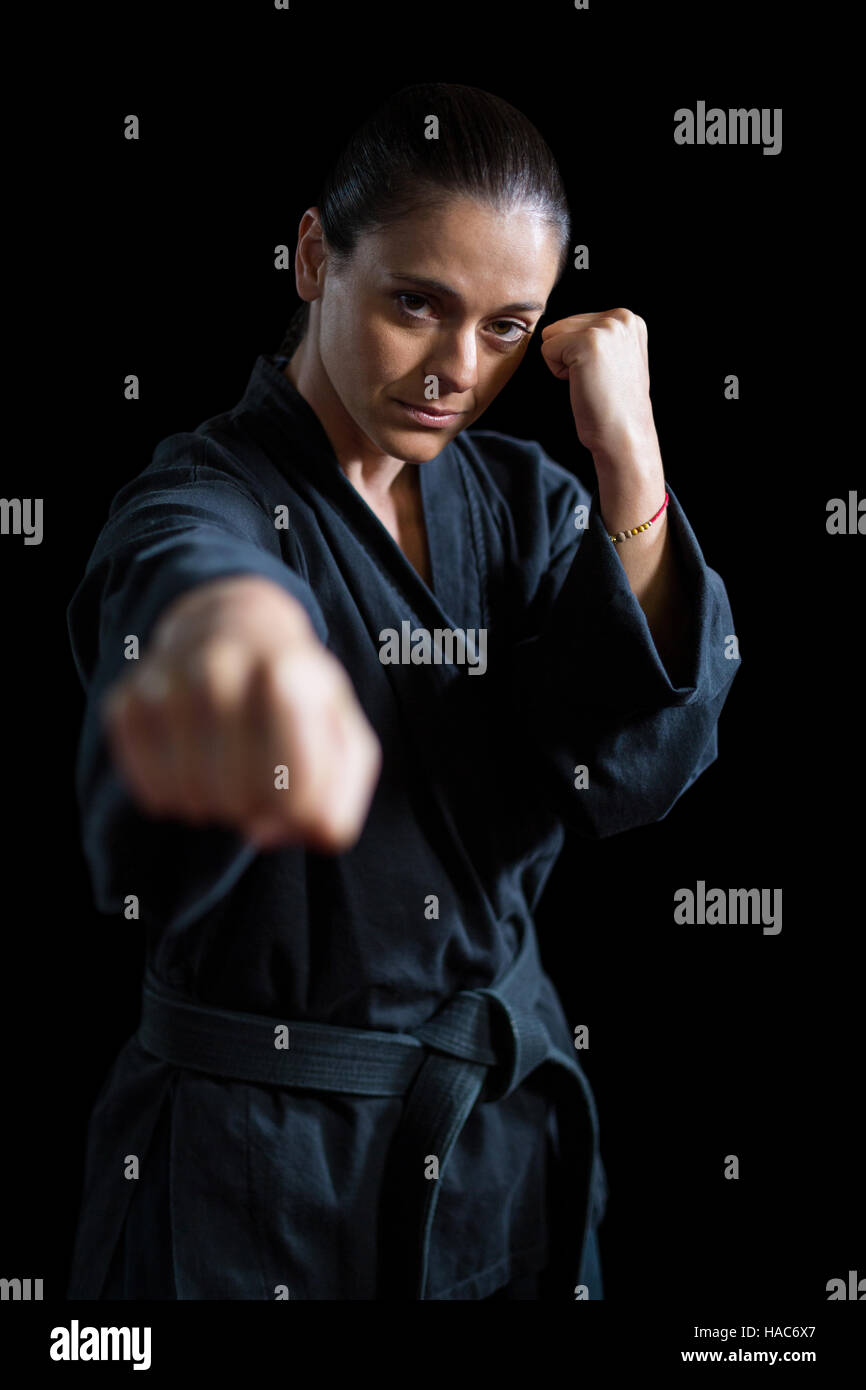 Female karate player performing karate stance Stock Photo - Alamy