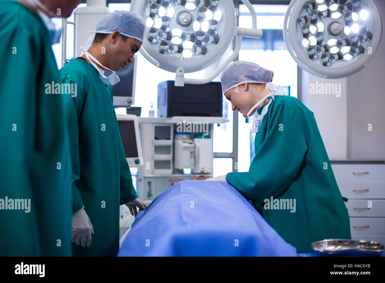 Surgeons performing operation in operation theater Stock Photo - Alamy